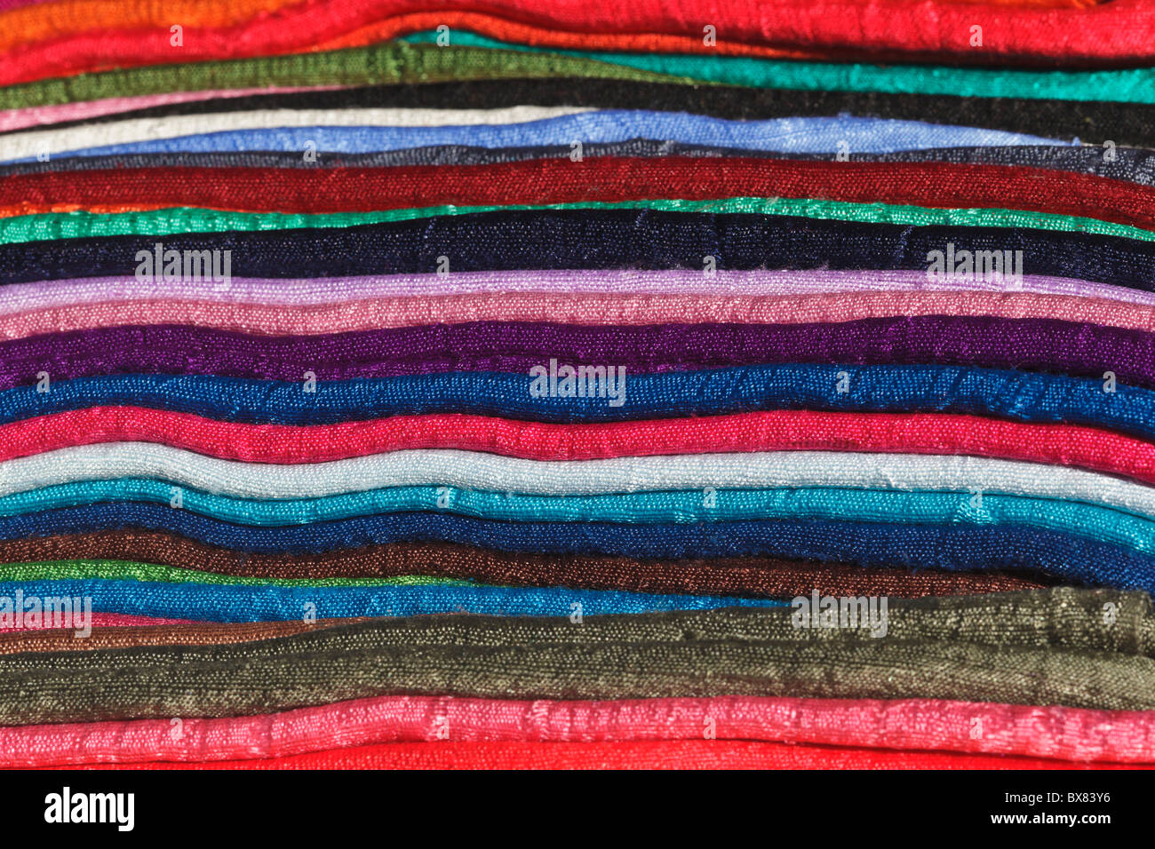 Stack / pile of colorful silk fabric. Charles Lupica Stock Photo - Alamy