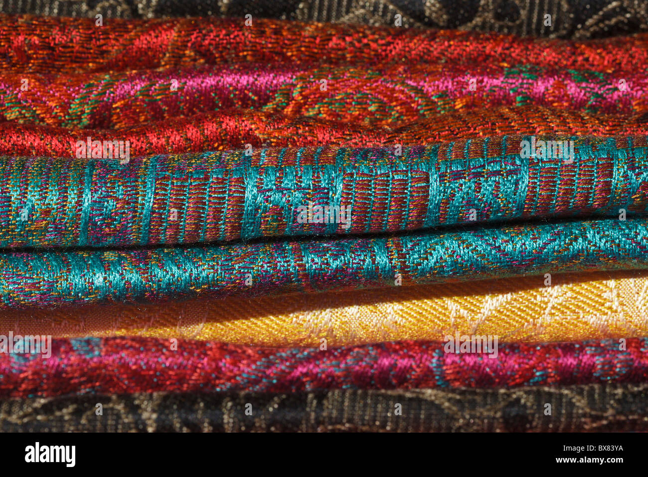 Stack / pile of colorful silk fabric. Charles Lupica Stock Photo - Alamy