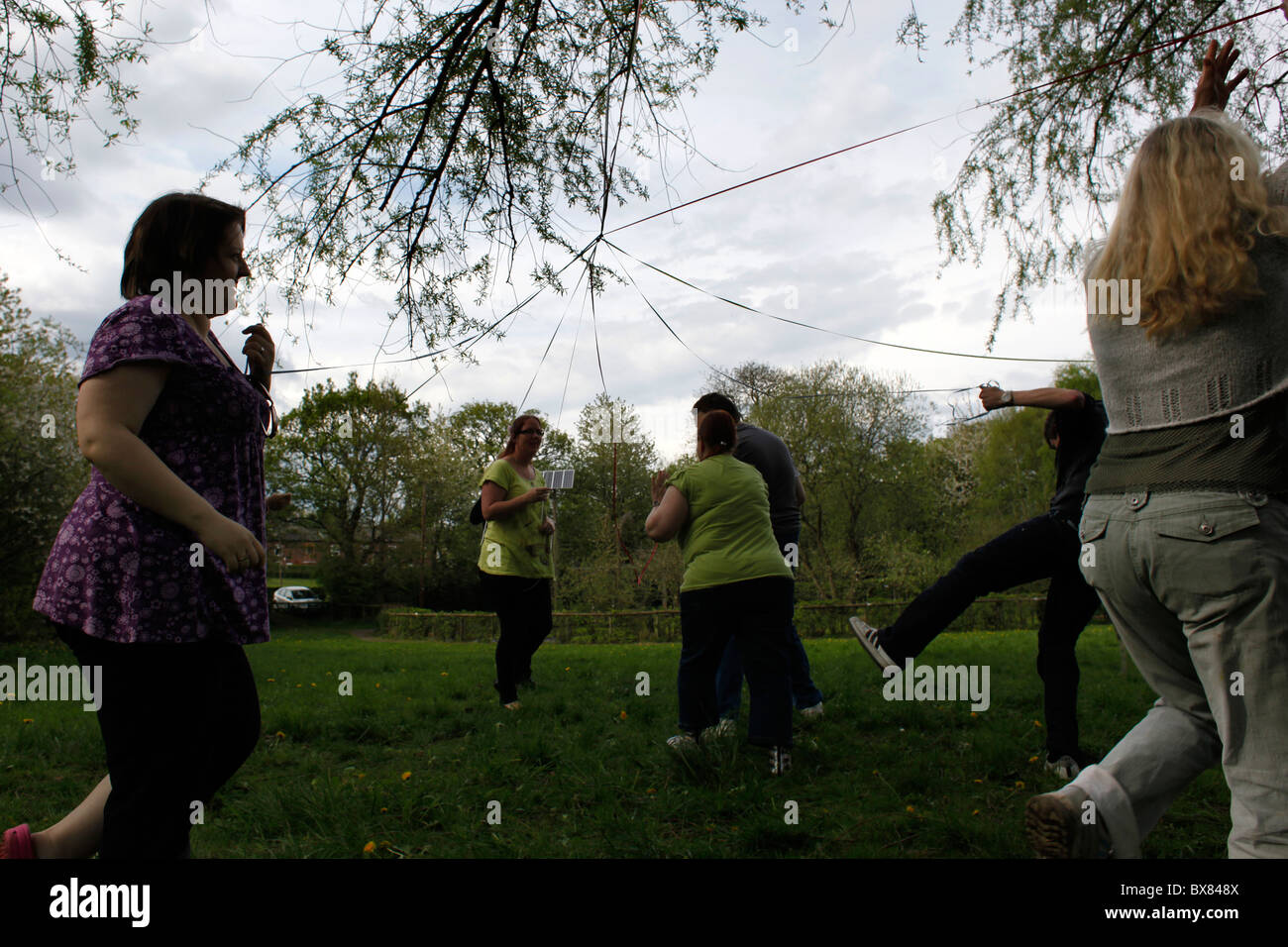 Pagans following the Wiccan path celebrate Beltane by dancing round a ...