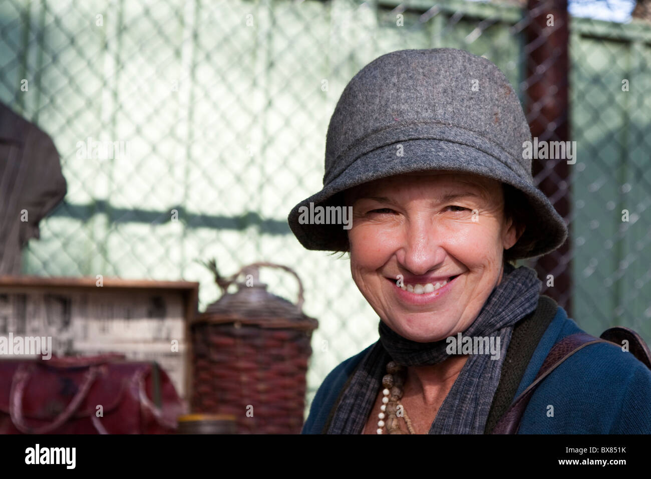 A woman stallholder is pleased by the attention her stall is receiving ...