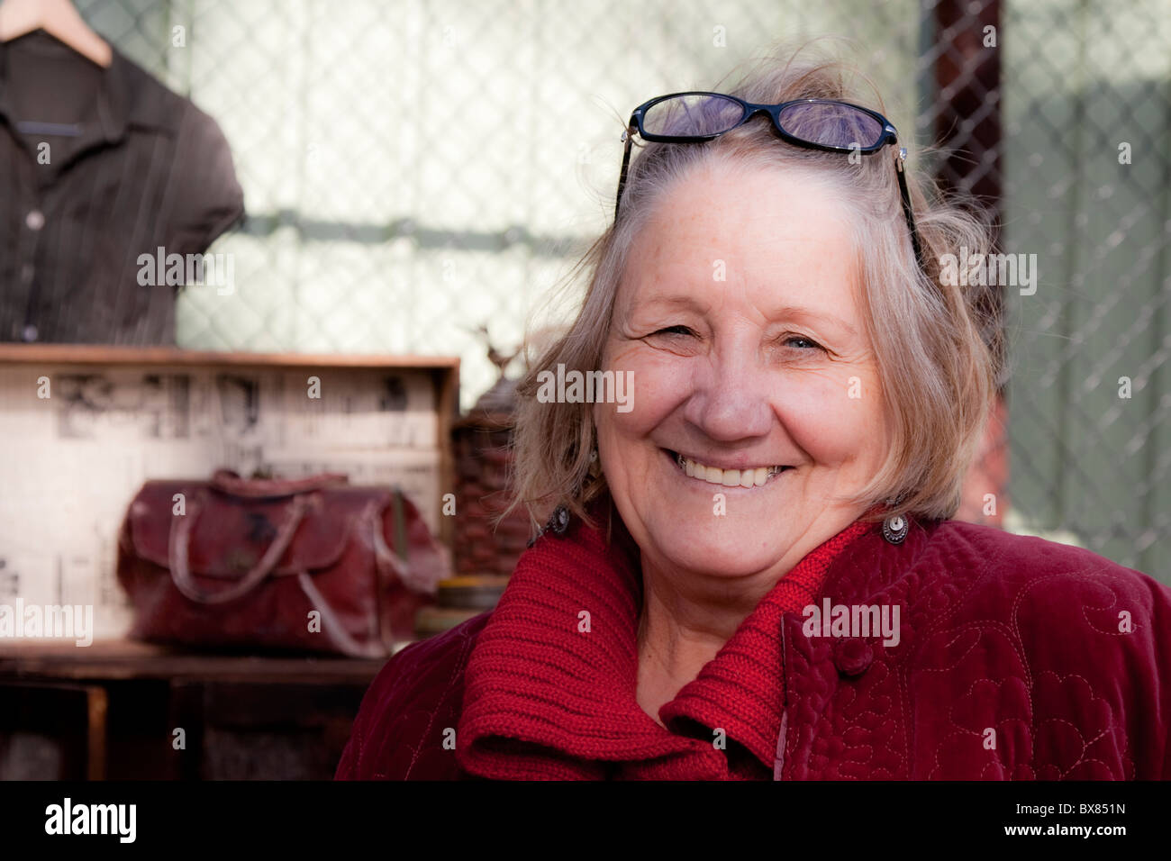 A woman stallholder is pleased by the attention her stall is receiving ...
