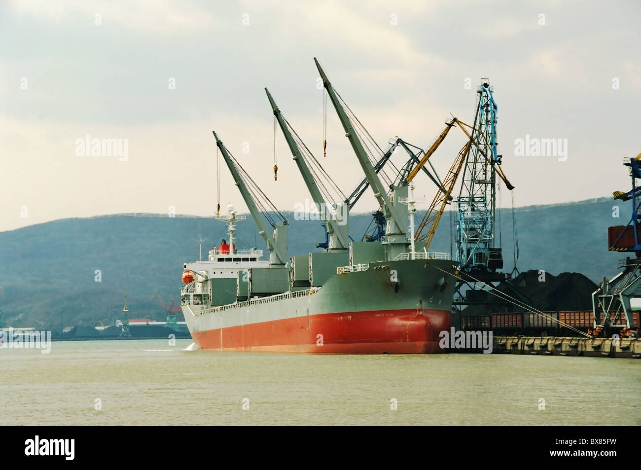 Sea vessel under coal loading in port Stock Photo - Alamy