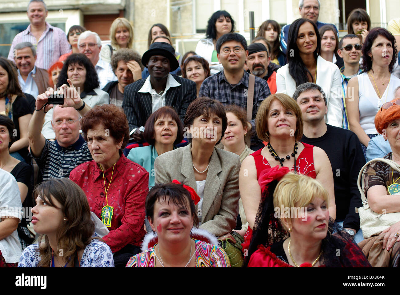 Crowd of many people. Audience of the carnival Stock Photo - Alamy
