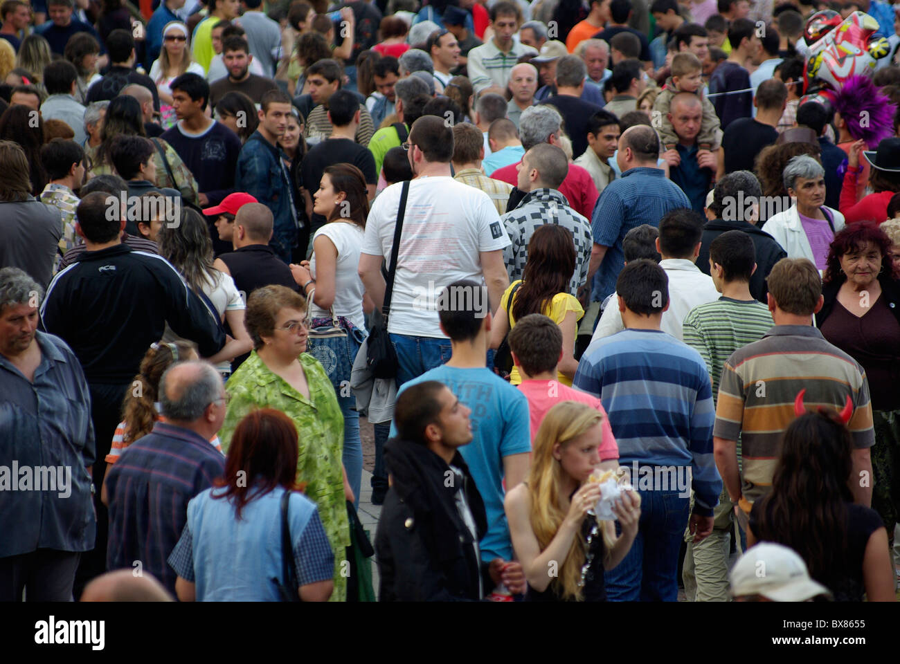 Crowd of many people. Audience of the carnival Stock Photo - Alamy