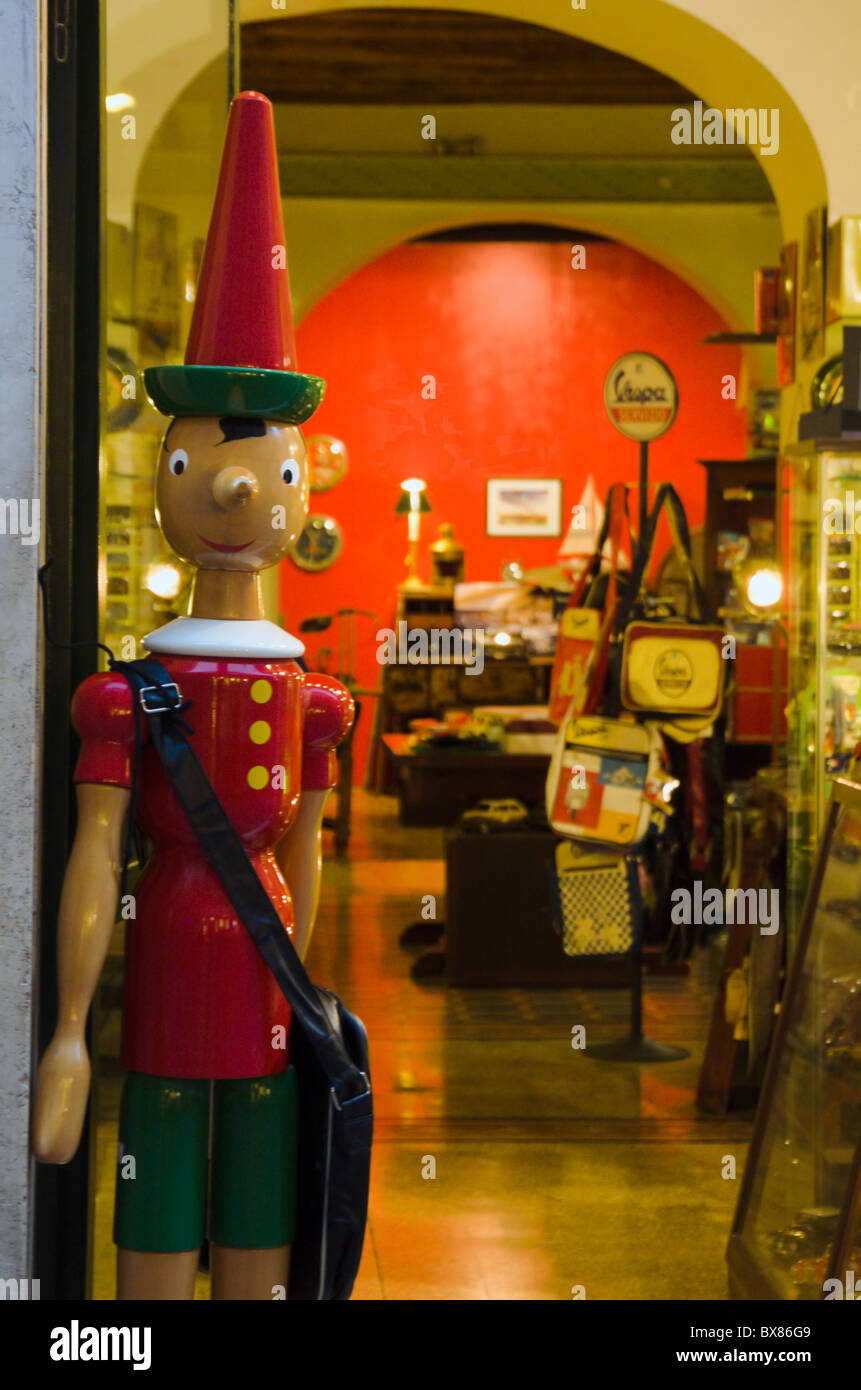 pinocchio wooden figure hanging outside a shop in Rome Stock Photo - Alamy