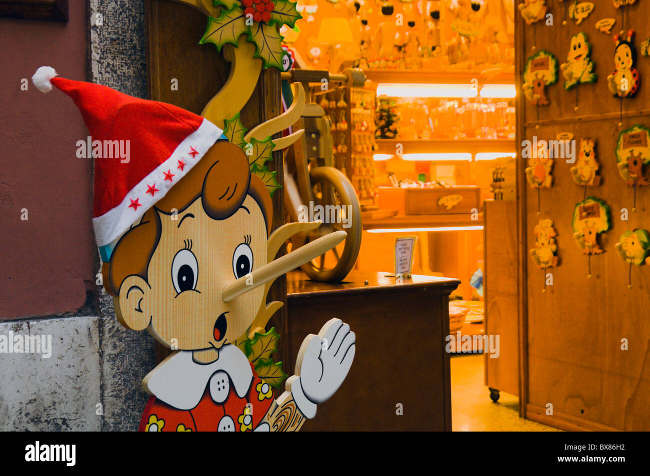 pinocchio wooden figure hanging outside a shop in Rome during Christmas ...