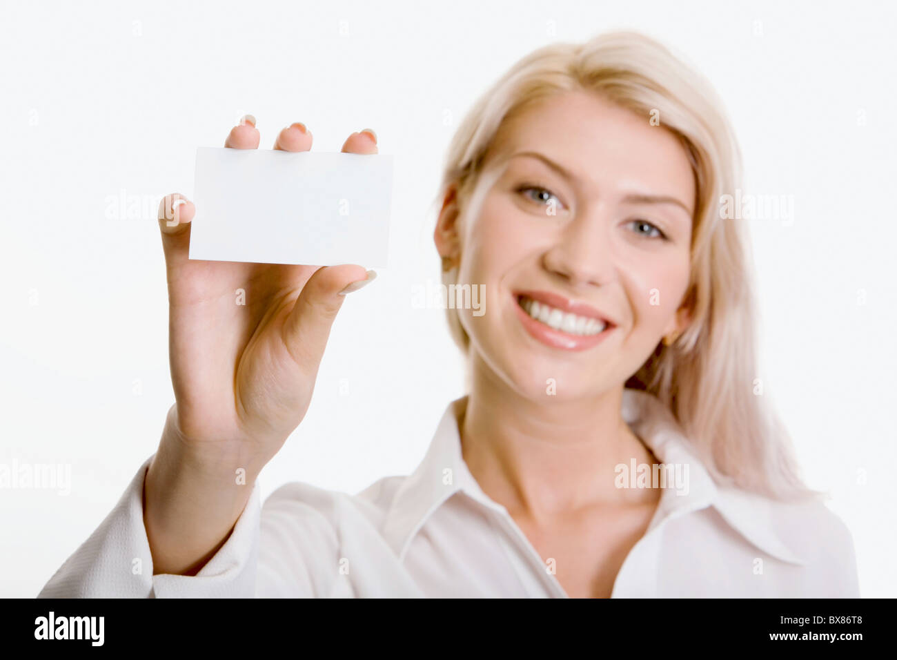 Young beautiful woman presenting her business card Stock Photo - Alamy