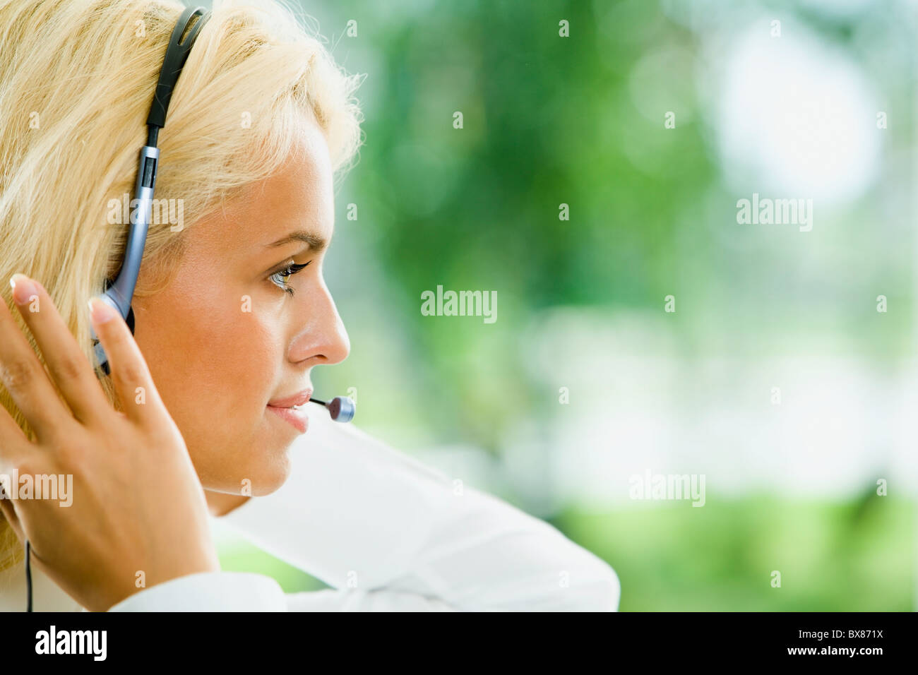 Portrait of friendly beautiful telephone operator Stock Photo - Alamy