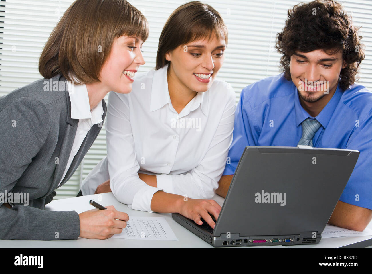 Successful professionals are training their new colleague in the office ...