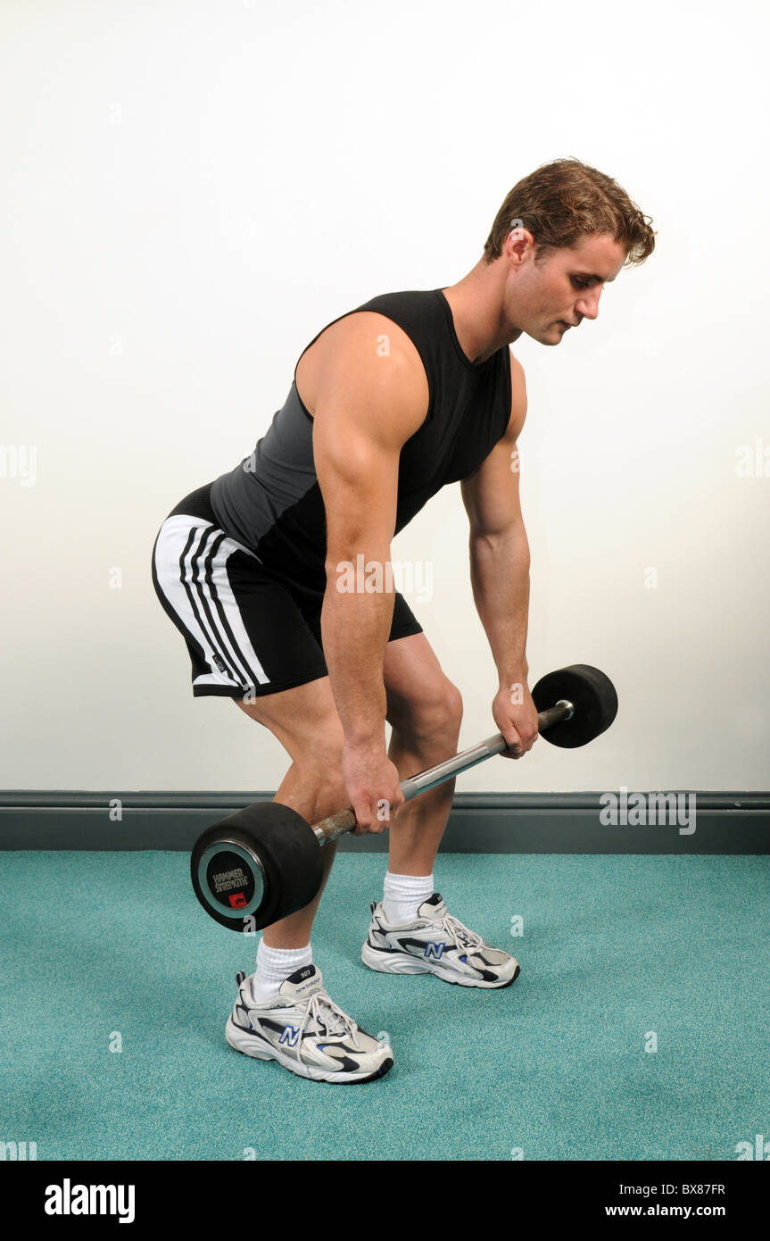 25-30 yr old male exercising in health club studio Stock Photo - Alamy