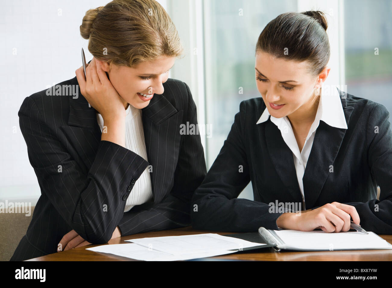 Young woman answers the questions of her potential employer Stock Photo ...