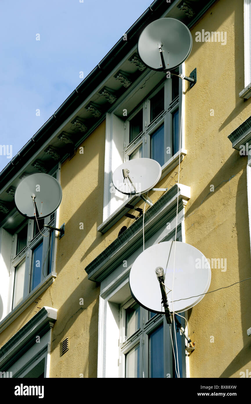 Satellite plates on a residential building facade Stock Photo - Alamy