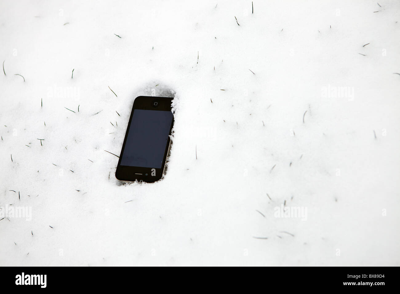 Apple Iphone laying on the ground in the snow Stock Photo - Alamy