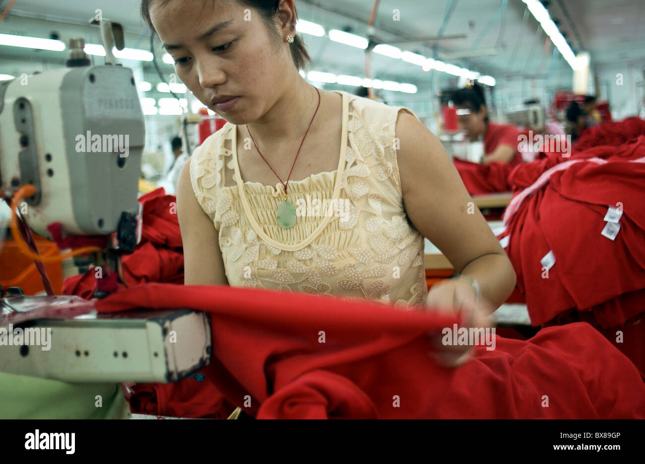 Garment workers at work in the United International Corp. garment ...