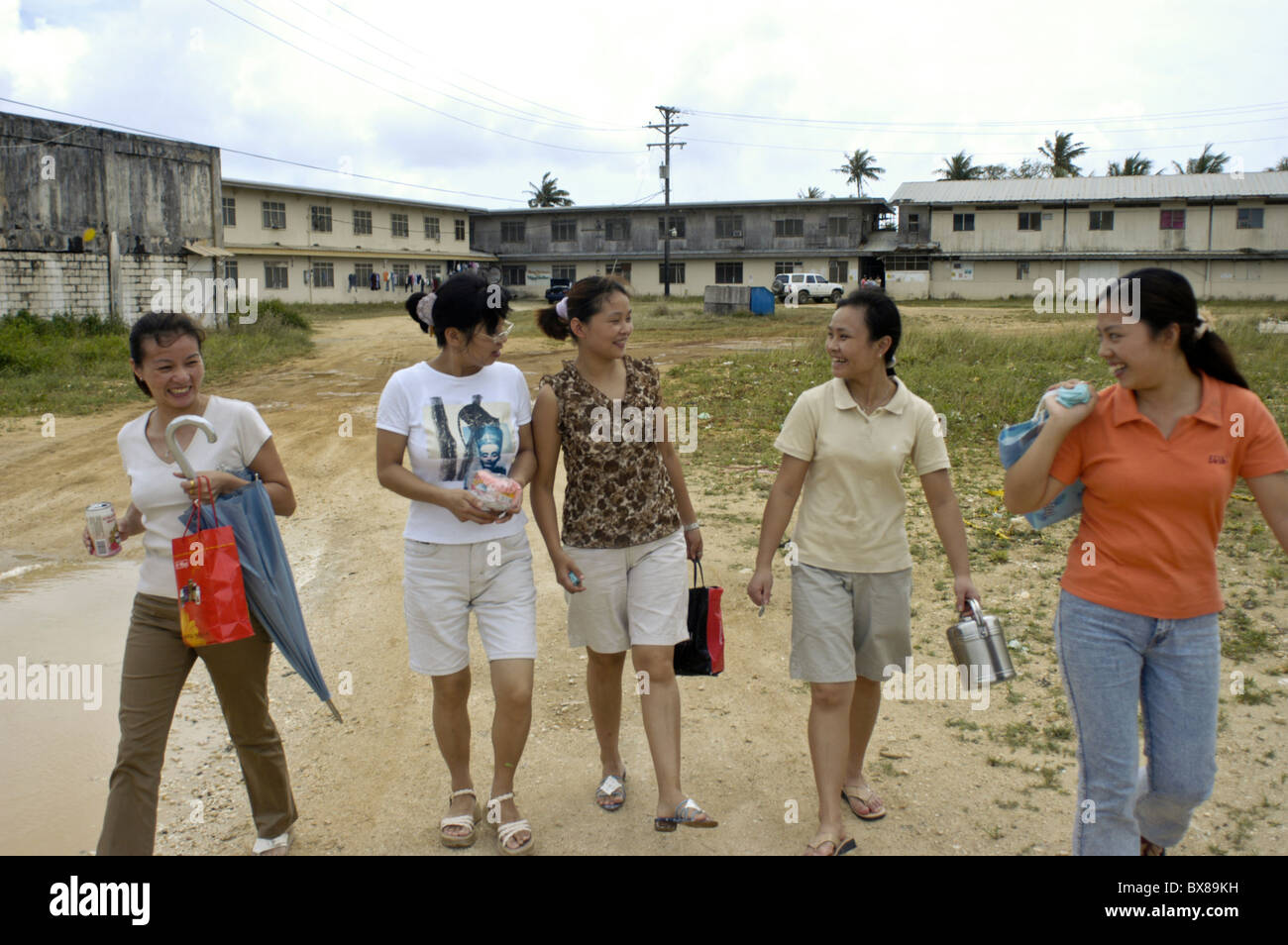 Female garments on a break outside the United International Corp ...