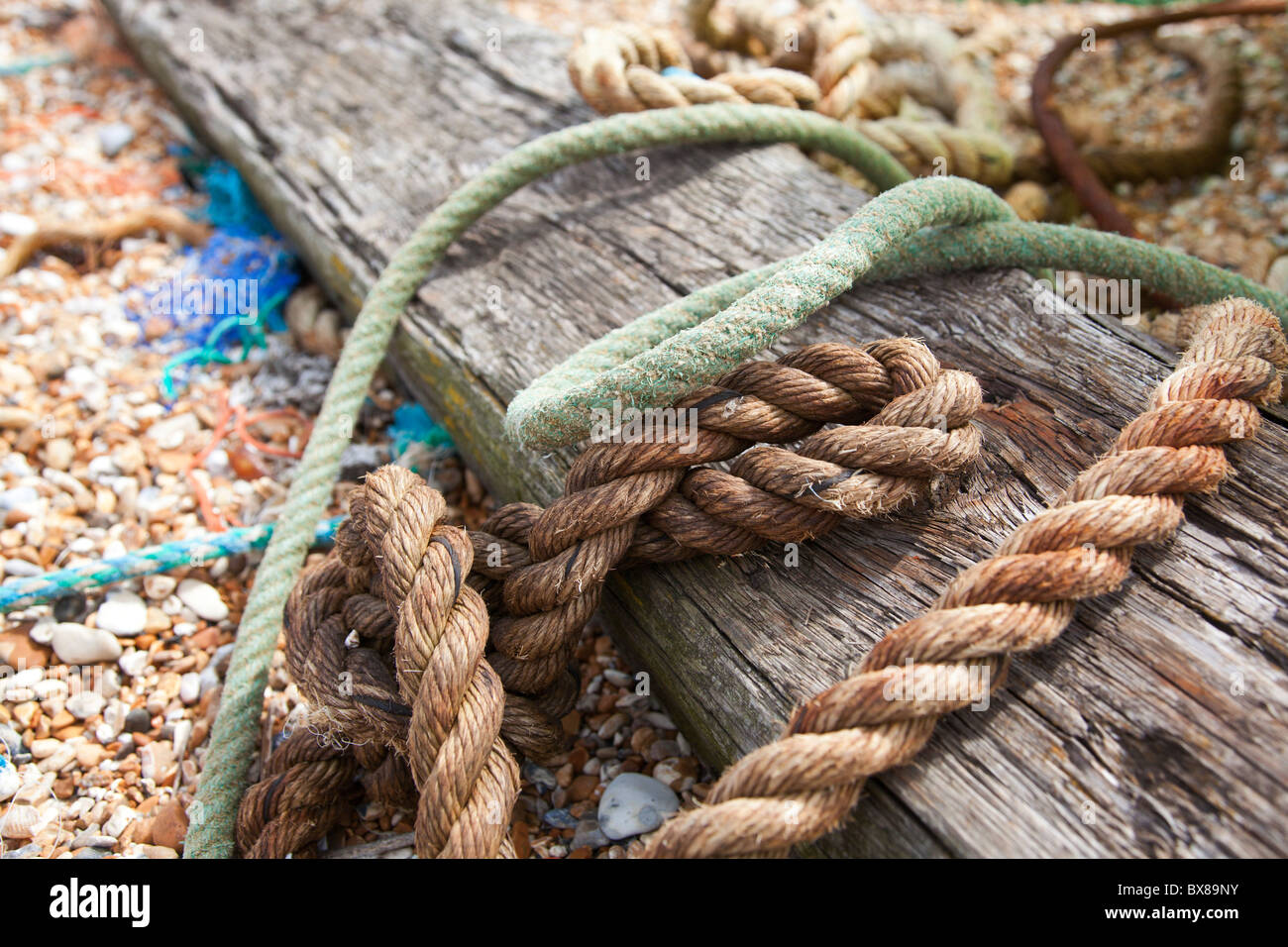 Rope and wooden sleeper on a shingle beach Stock Photo - Alamy