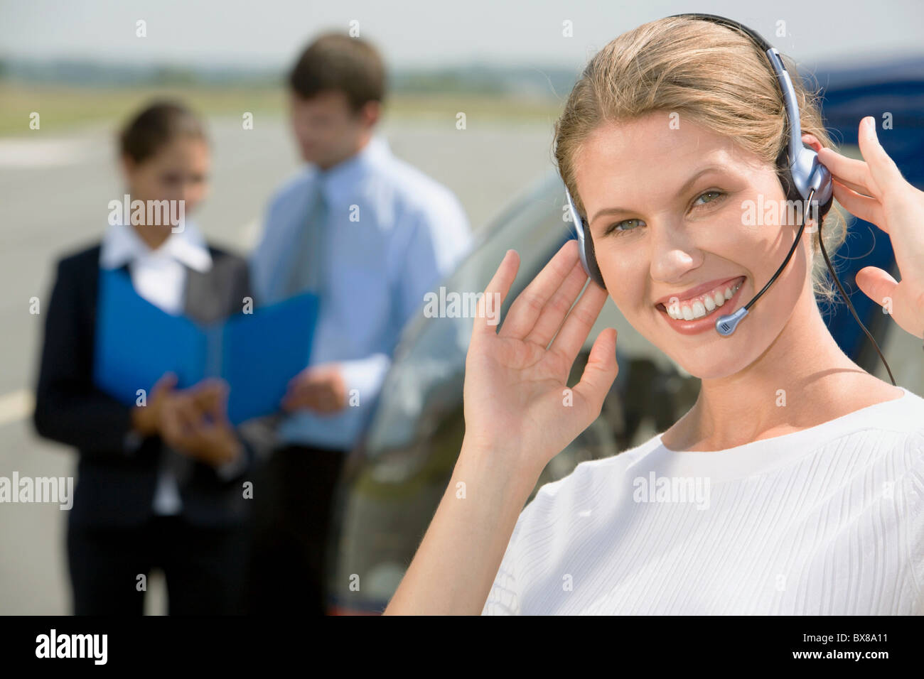 Beautiful Customer Representative with headset smiling on a background ...