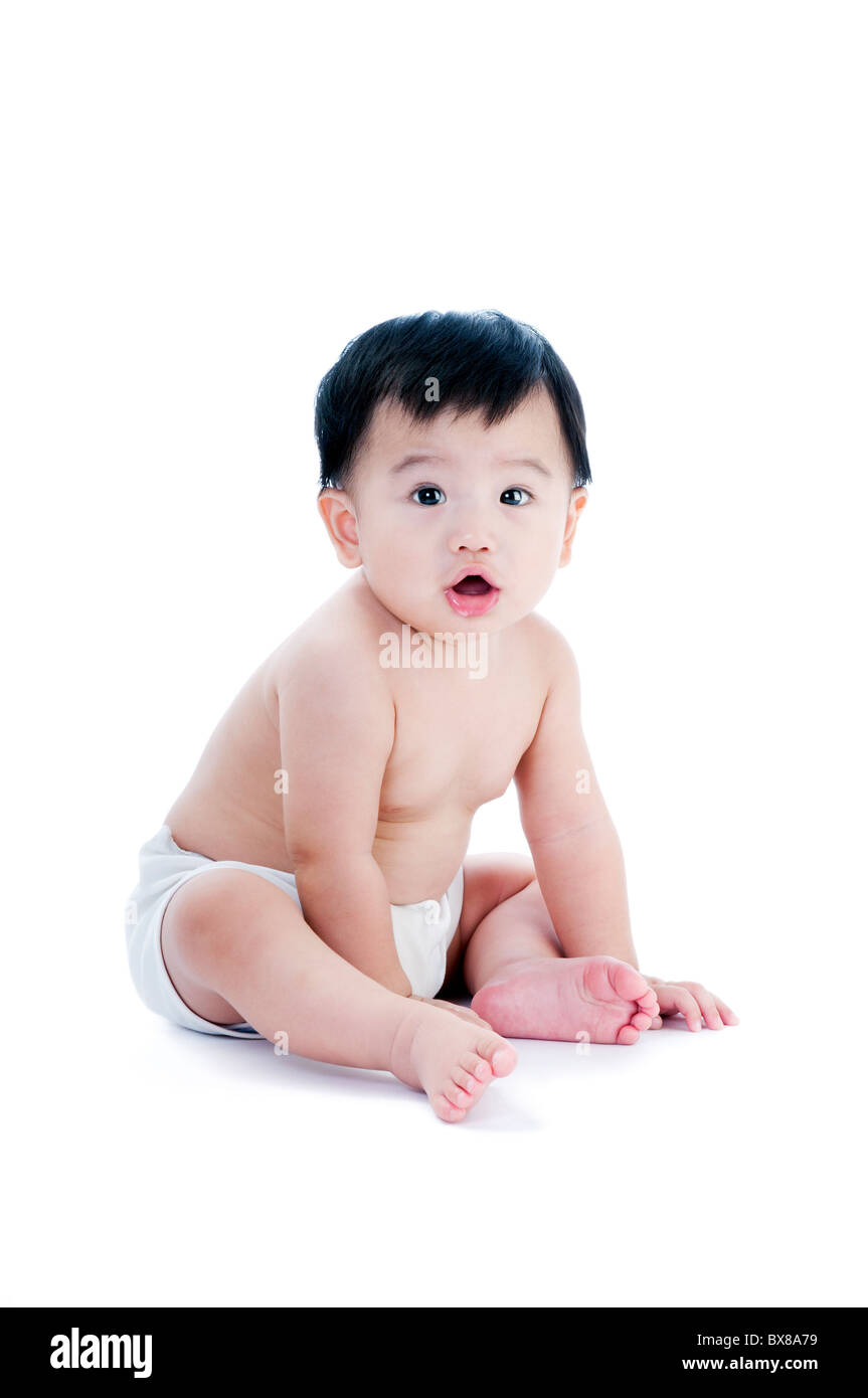 An adorable infant baby sitting on floor Stock Photo - Alamy