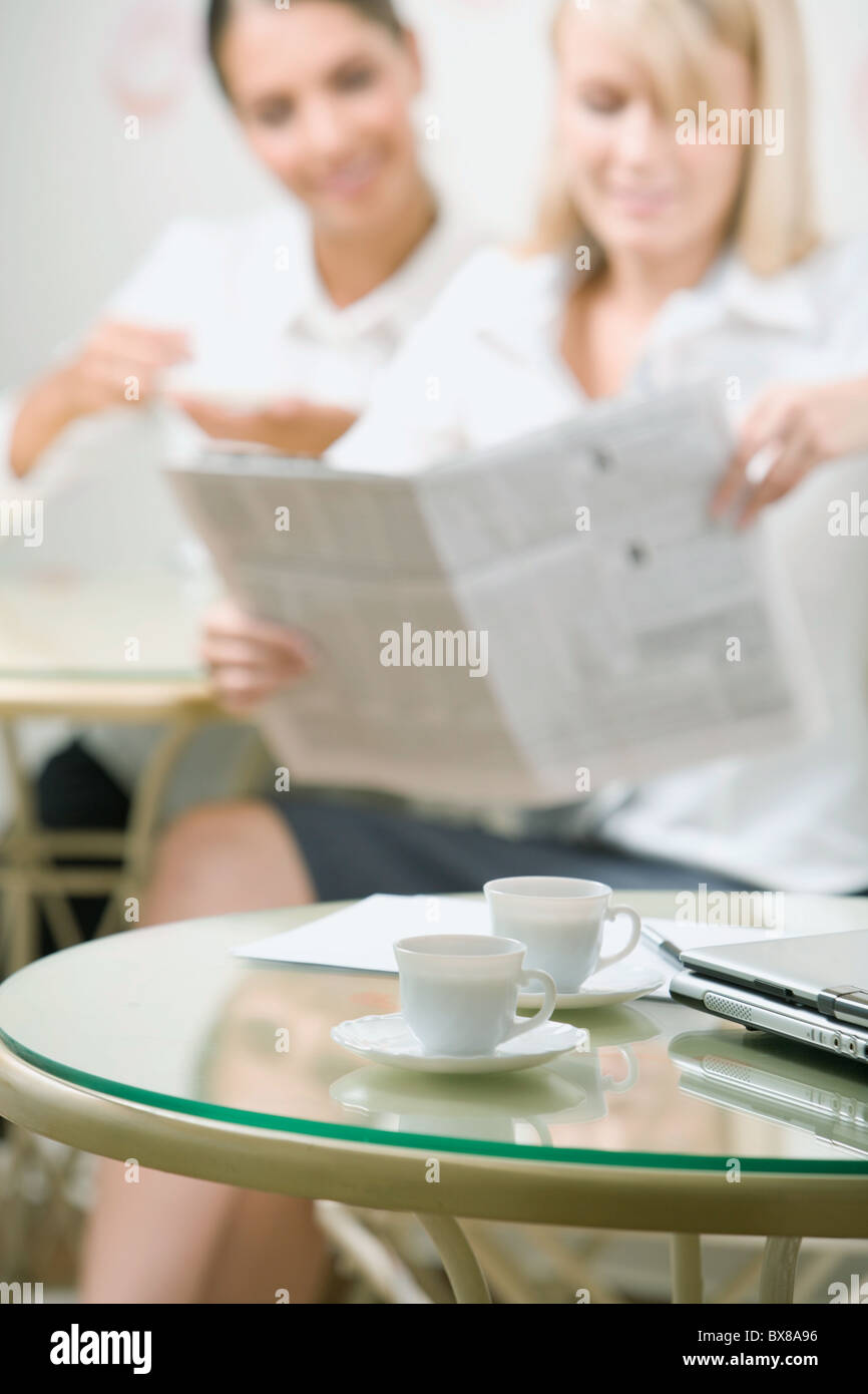 Two tea cups on the round table Stock Photo - Alamy