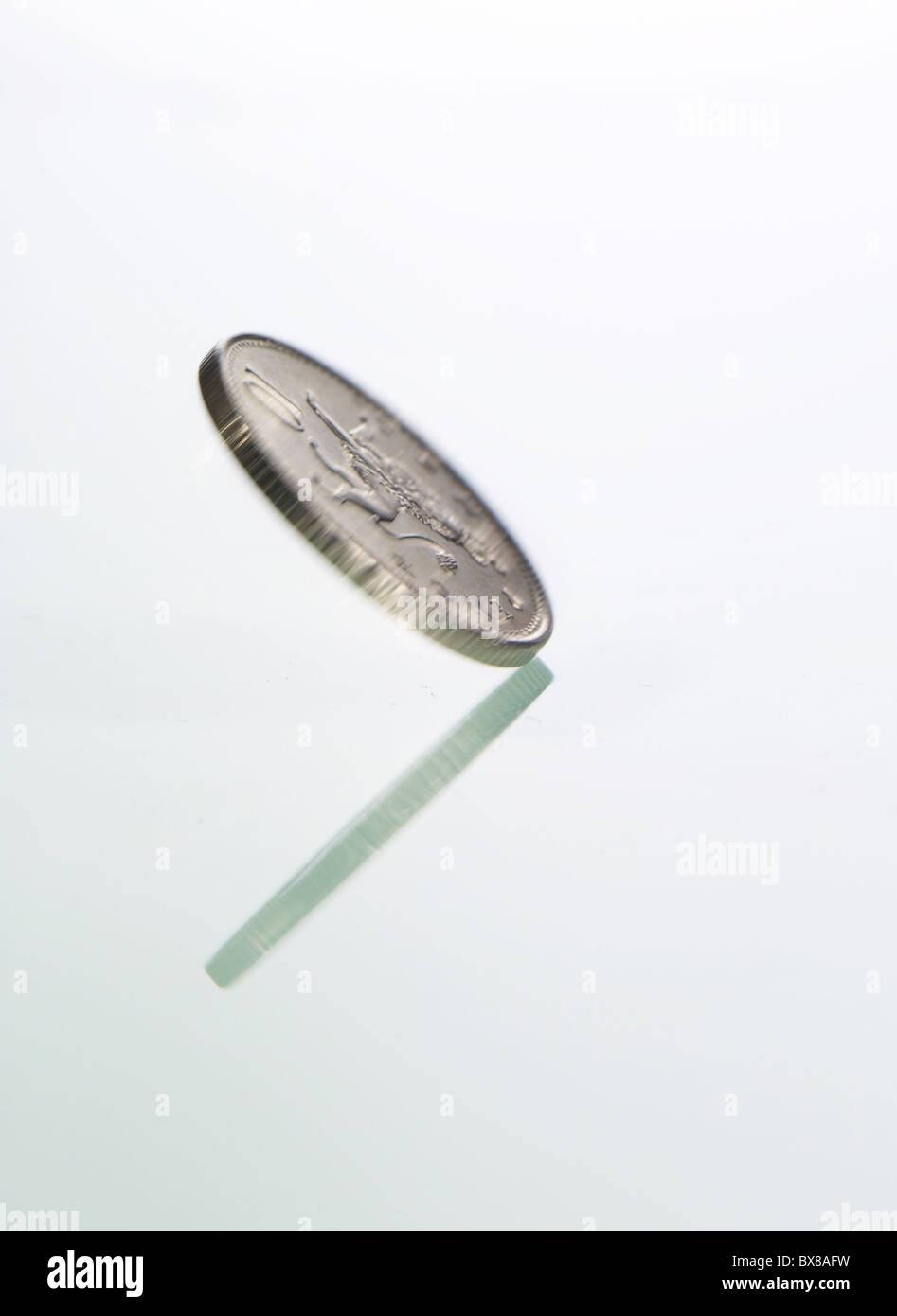 Coin spinning hi-res stock photography and images - Alamy