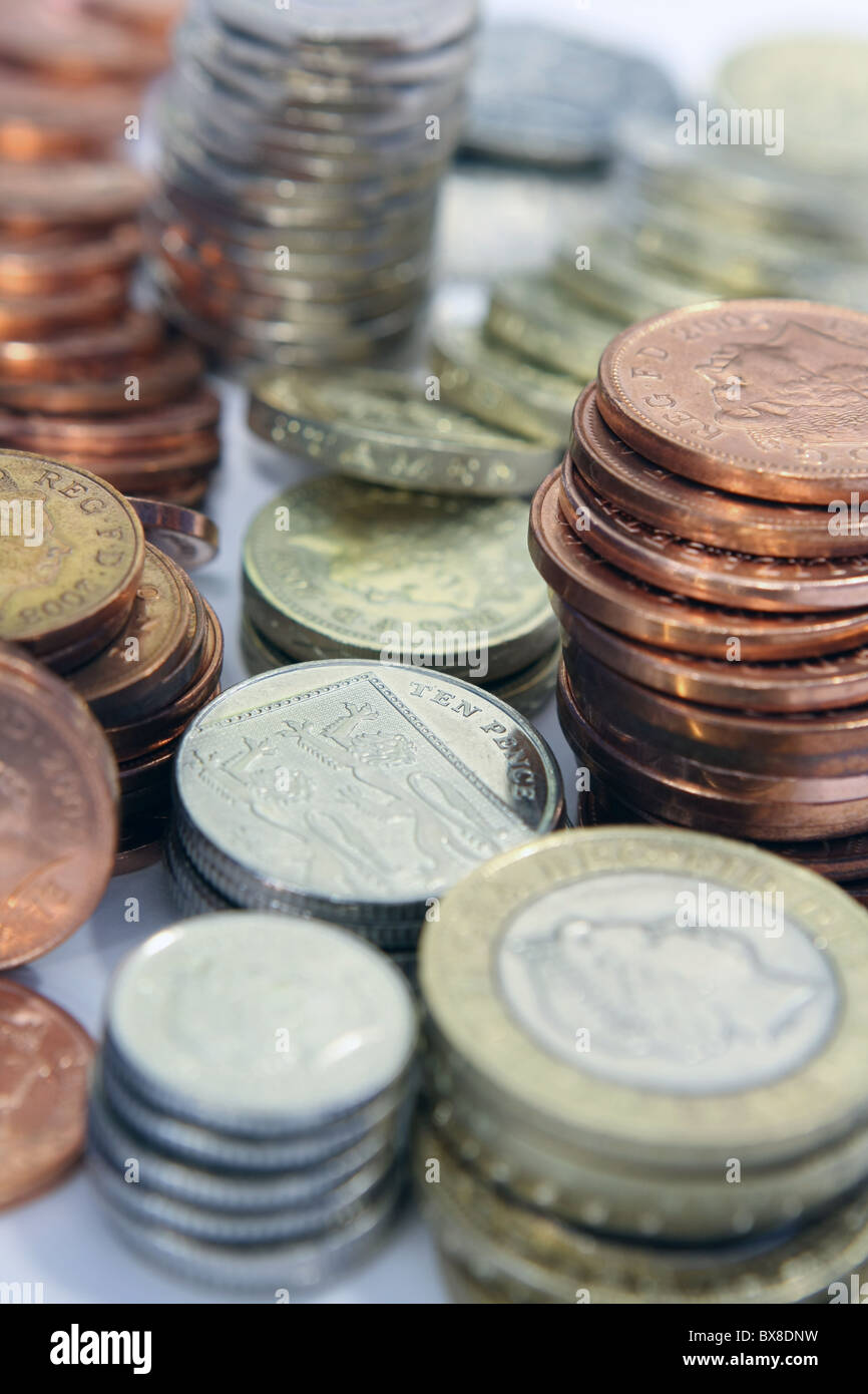 stacks of different denomination sterling coins with a stack of £1 ...