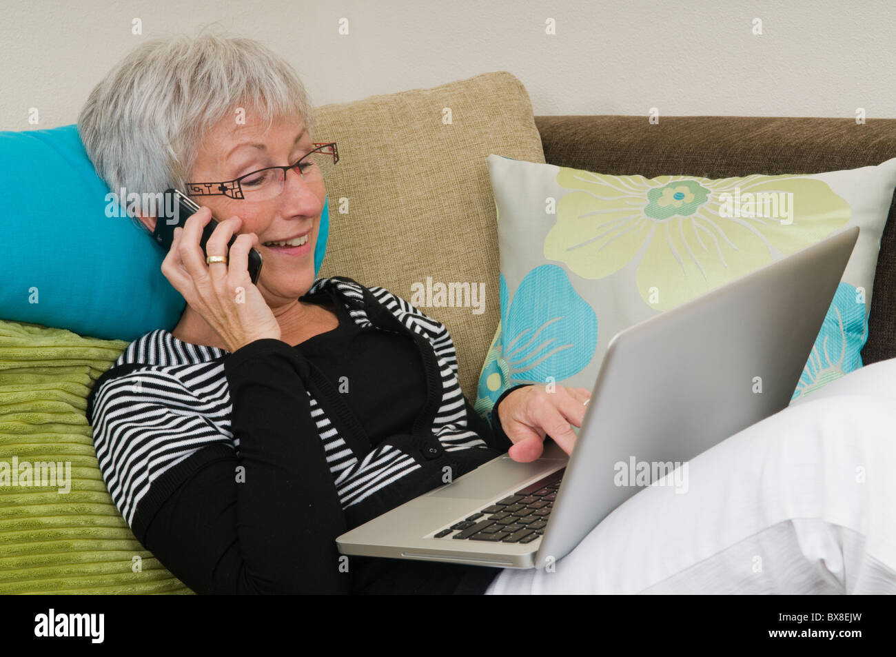 Senior woman with laptop Stock Photo - Alamy