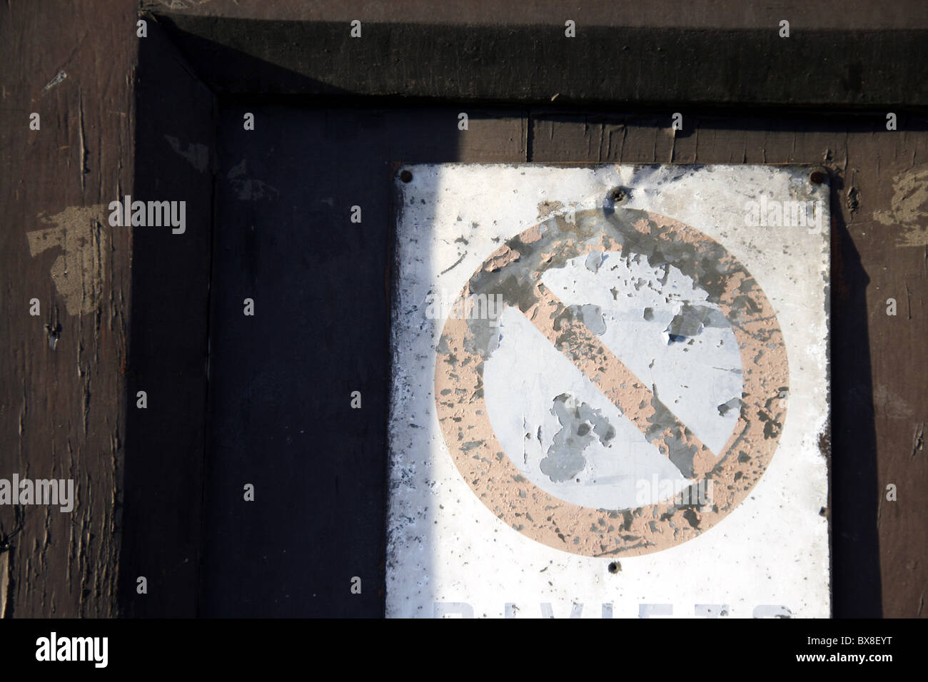 old dirty no parking stopping sign notice in city street Stock Photo ...