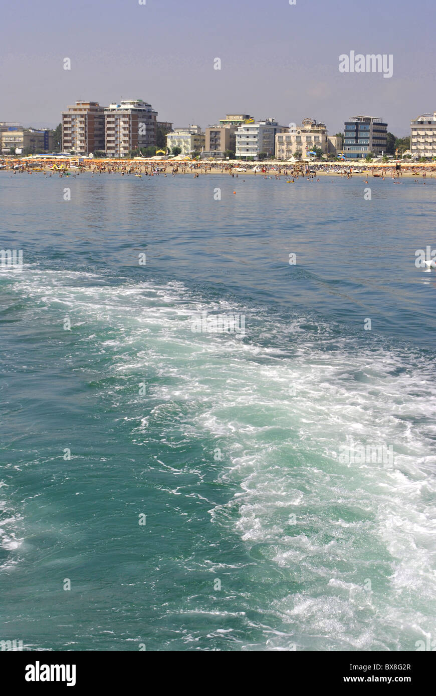 small tidal wave slamming on a sandy beach Stock Photo - Alamy