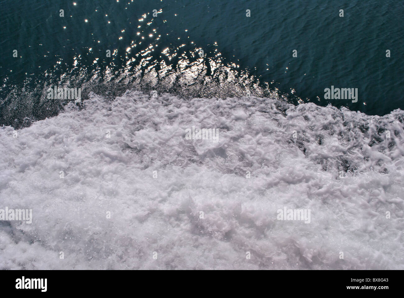 sea foam created by the passage of the boat Stock Photo - Alamy