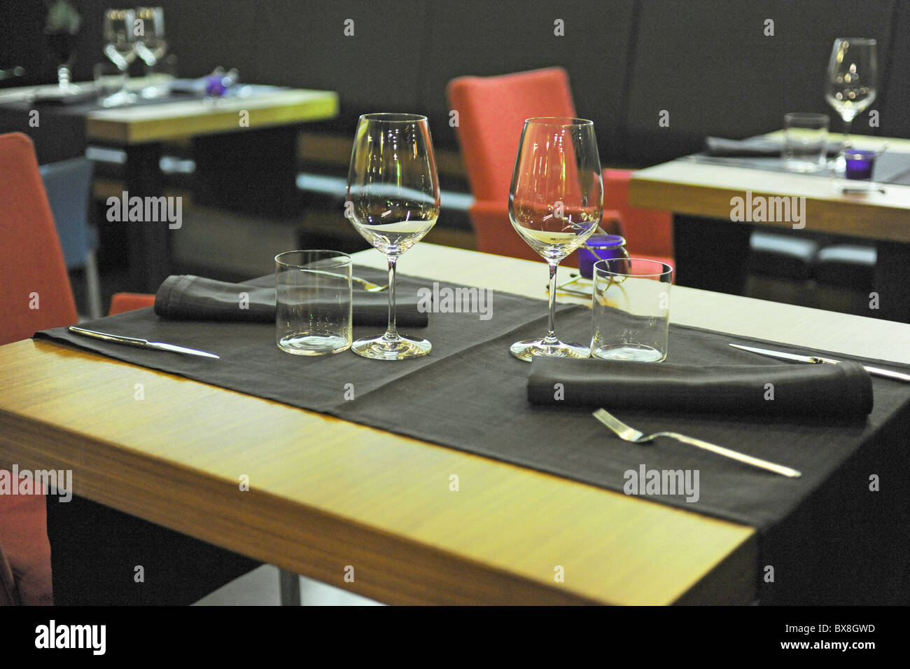 dining room with glass tableware and serving dishes Stock Photo - Alamy