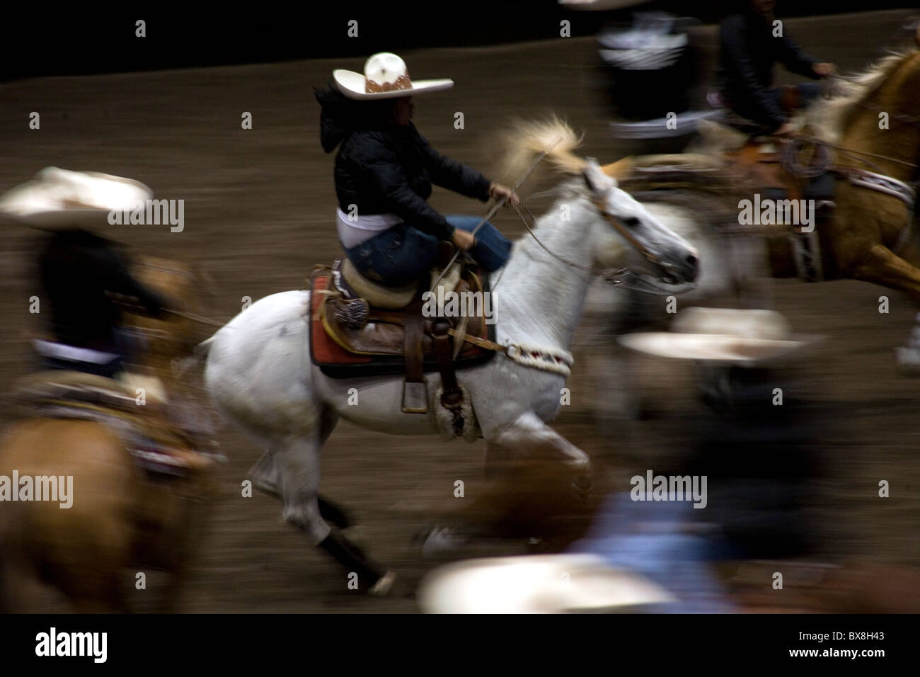 Mexican charros practice with their sons before the start of the ...