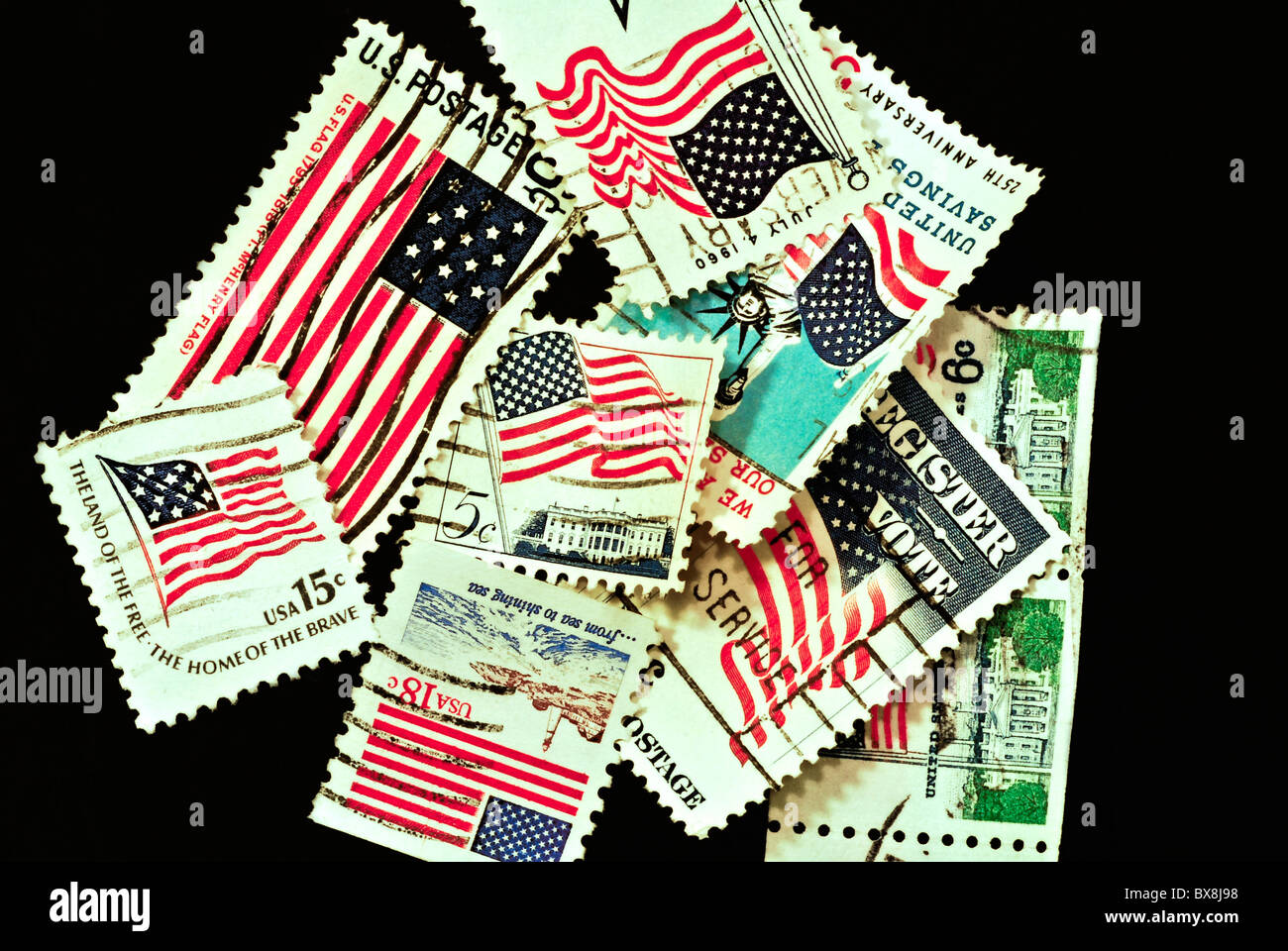 Eight different postage stamps of the US flag Stock Photo - Alamy