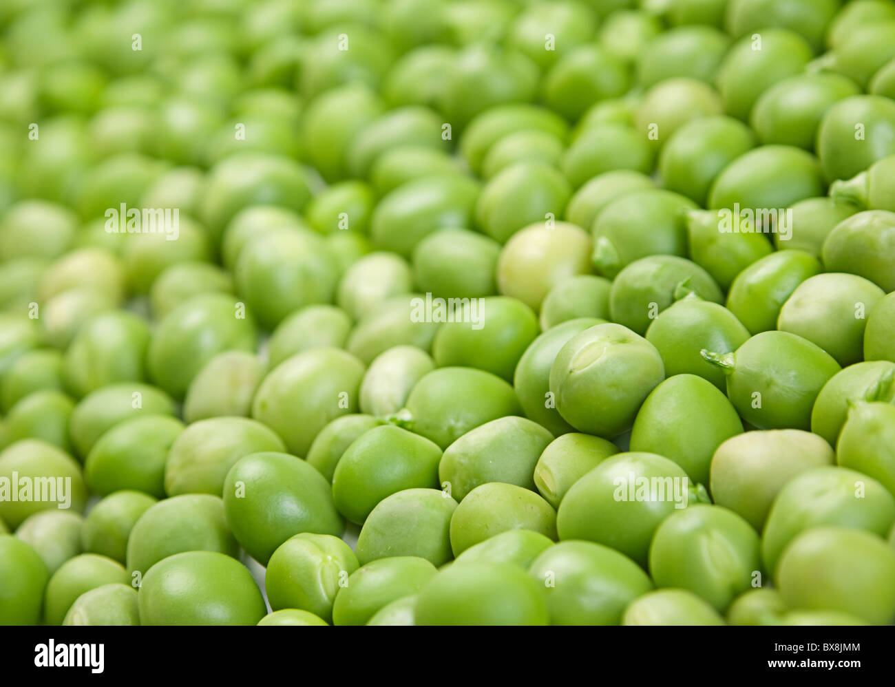 Fresh peas background Stock Photo - Alamy