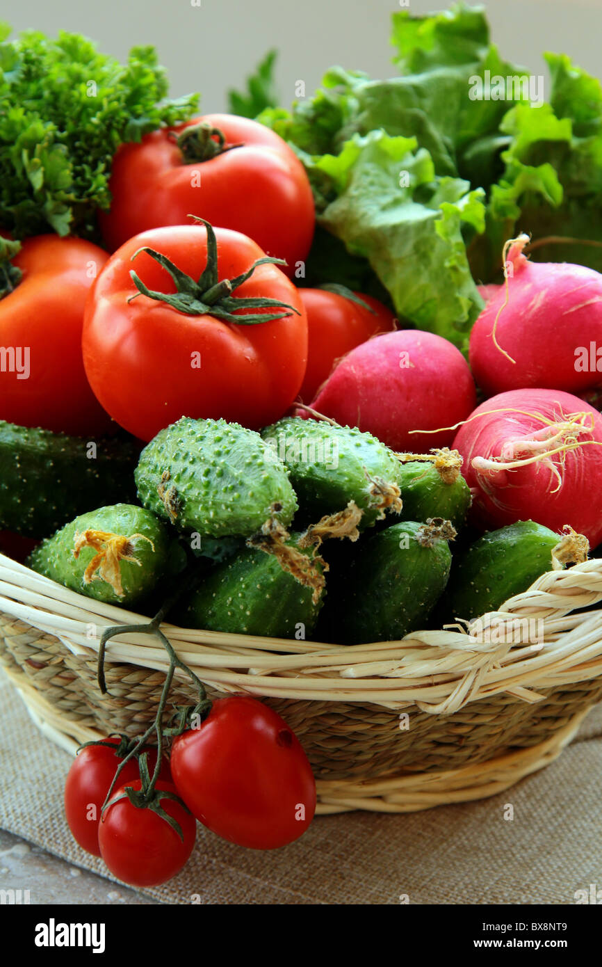 Fresh vegetables and herbs mix in a wicker basket Stock Photo - Alamy