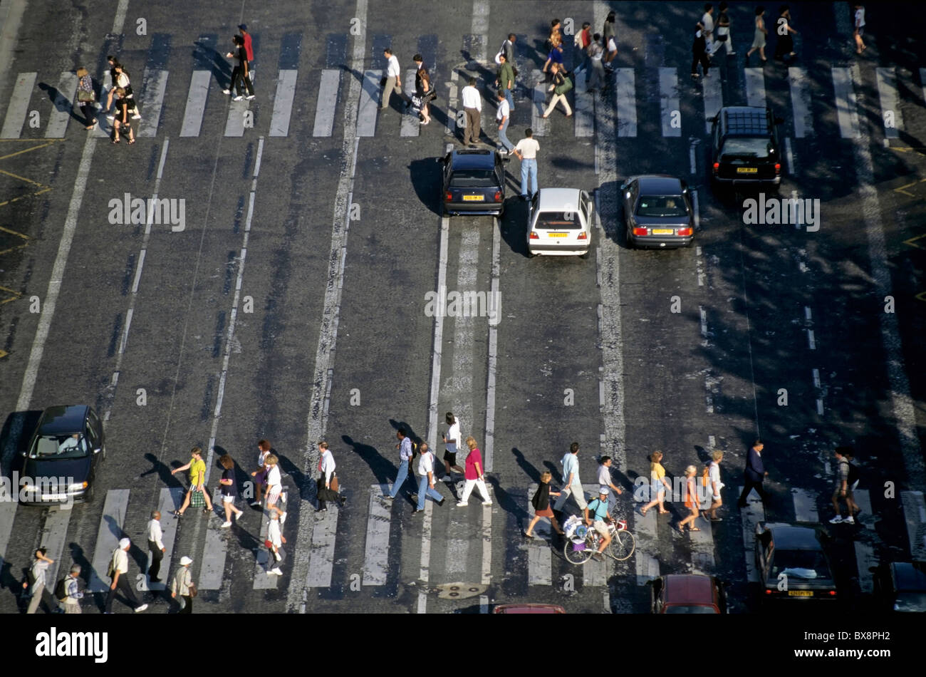 Pedestrians on a zebra crossing on the Champs-Elysees, Paris, France ...