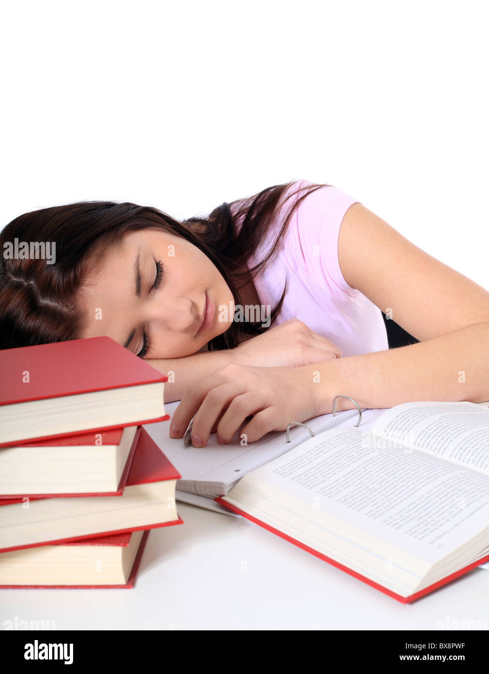 Teenage girl napping on her study papers. All on white background Stock ...