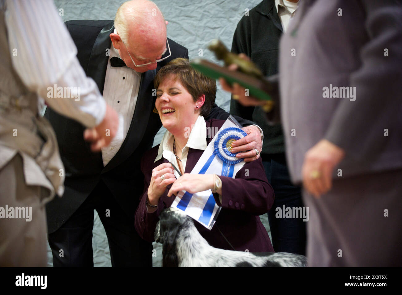 Judges celebrates with a champion dog breeder during the ASC Flushing ...