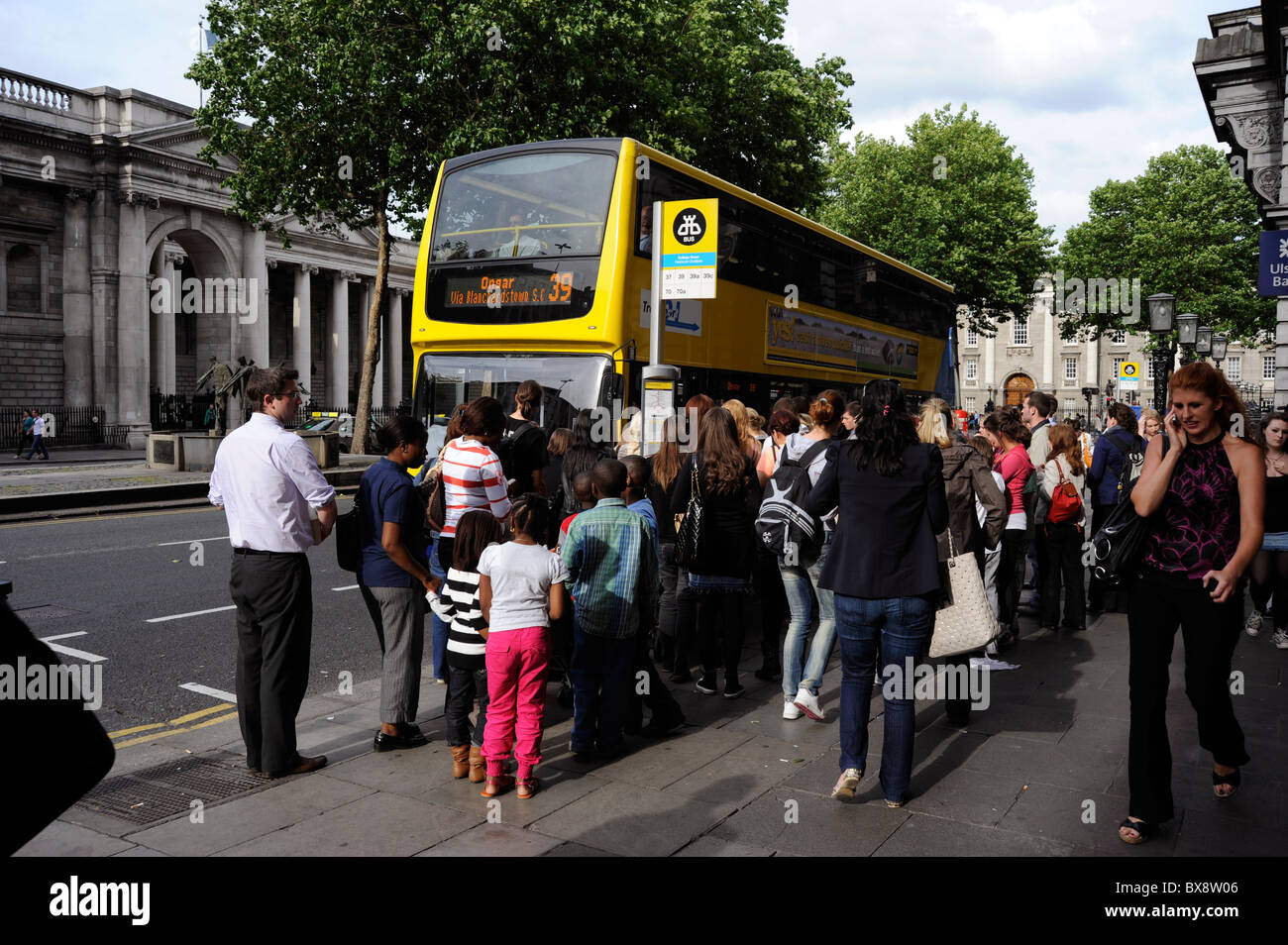 People at the bus stop, Dublin city, Ireland Stock Photo - Alamy