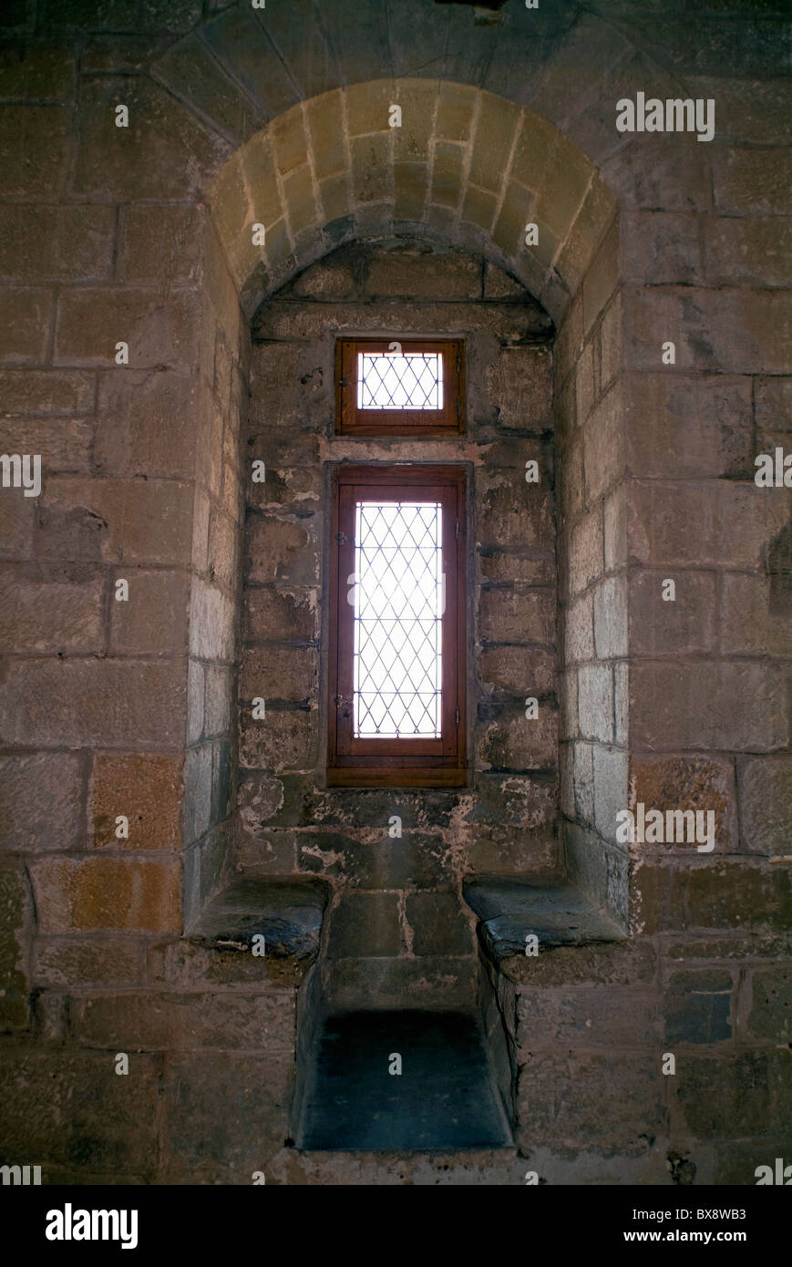 Old stone window seat inside a castle in the medieval city of ...