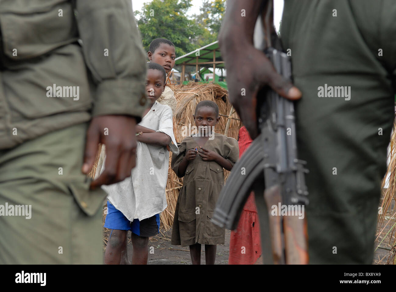 Children with armed FARDC Congolese government soldier with a ...
