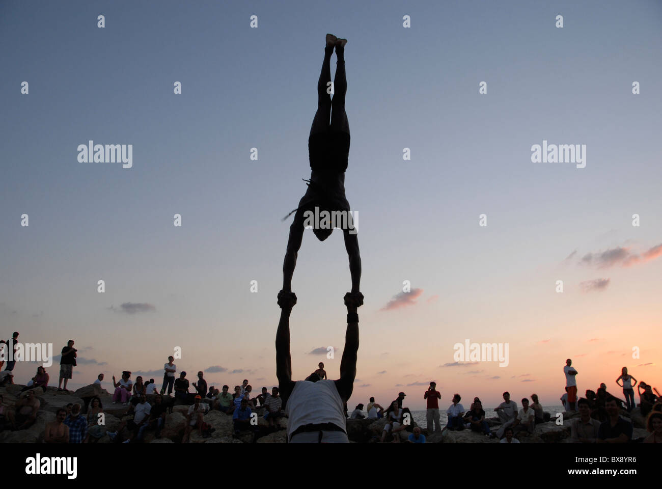 Young African men performing handstand balancing in Banana Beach also ...