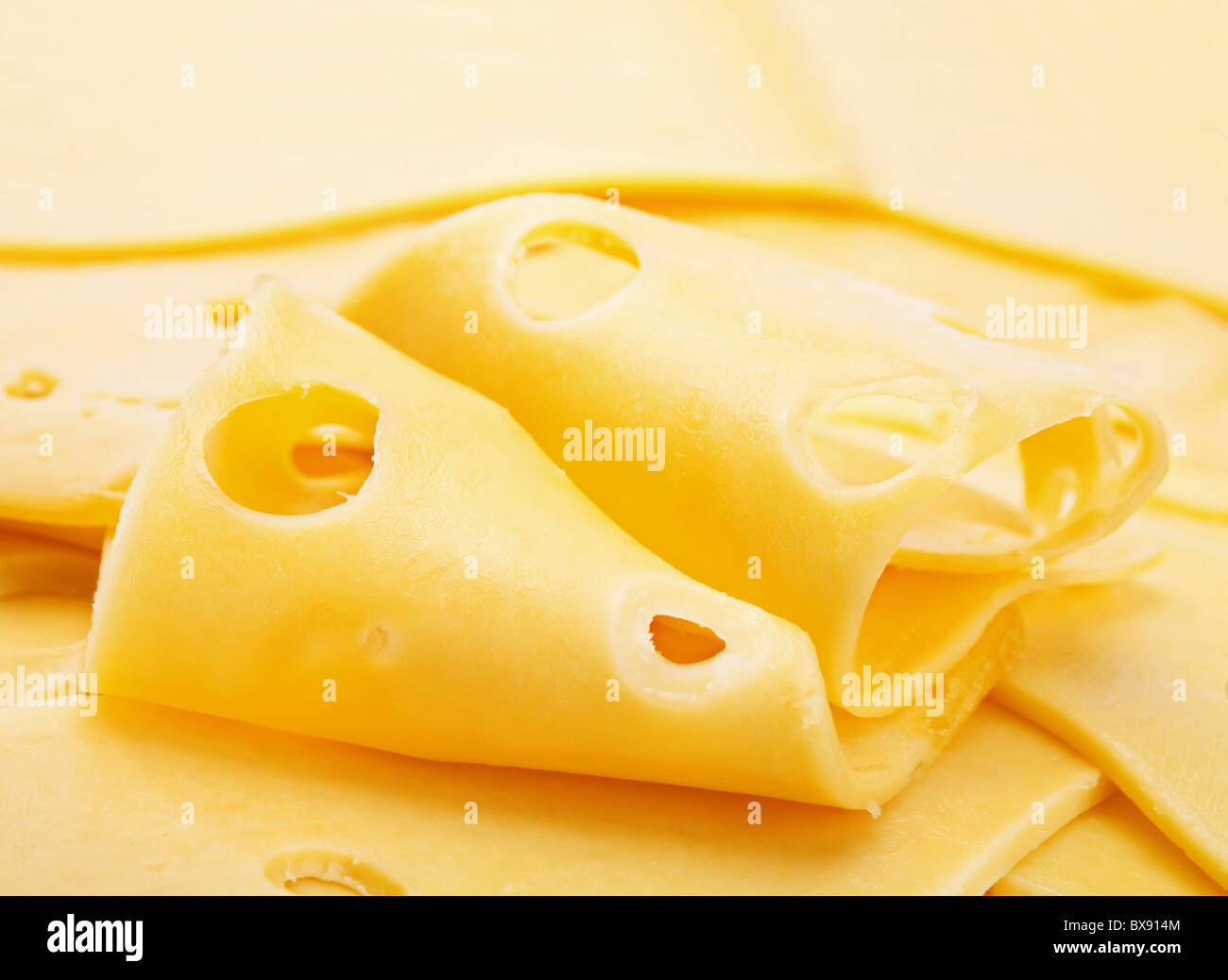 Cheese slice background Stock Photo - Alamy