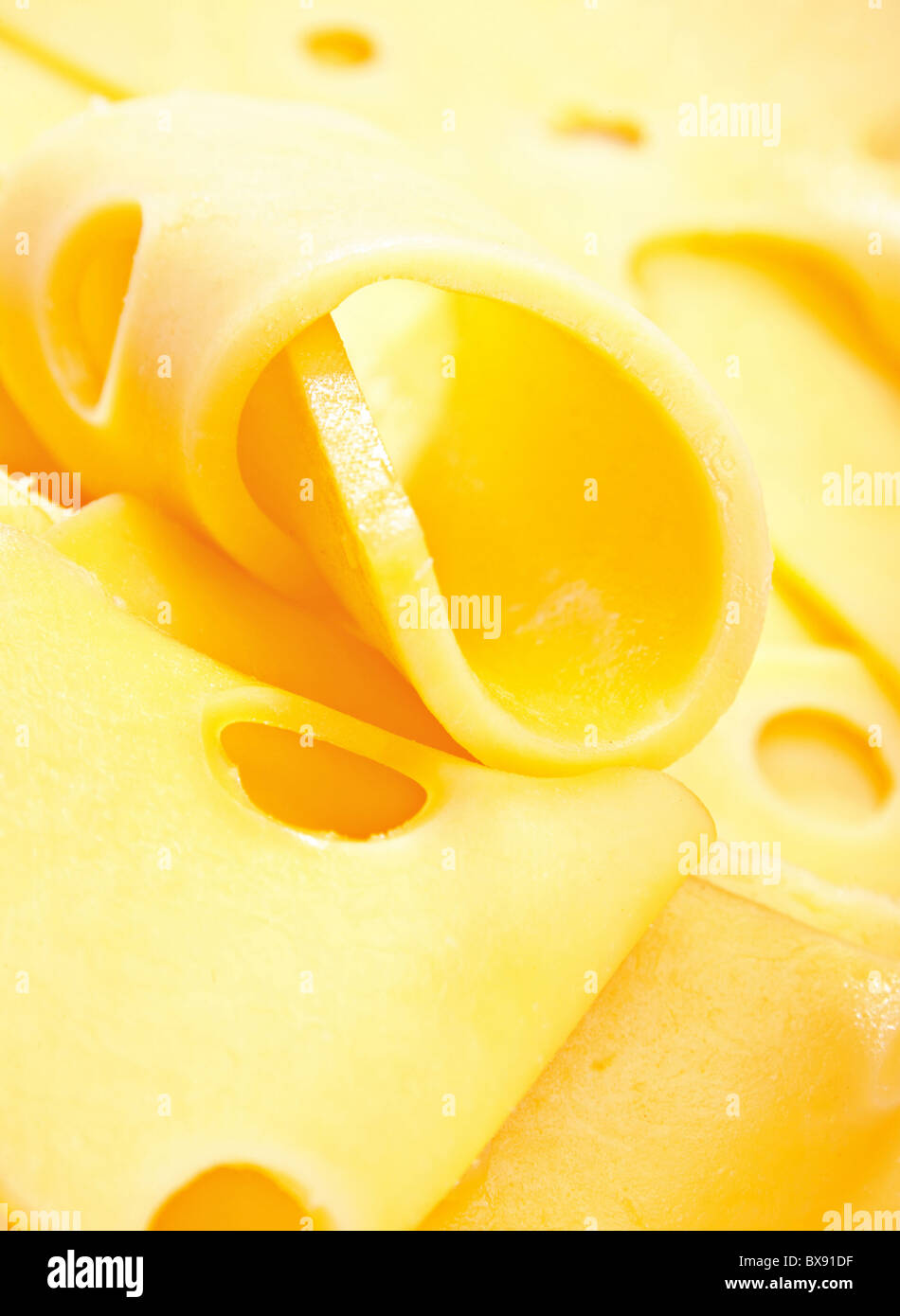 Cheese slice background Stock Photo - Alamy