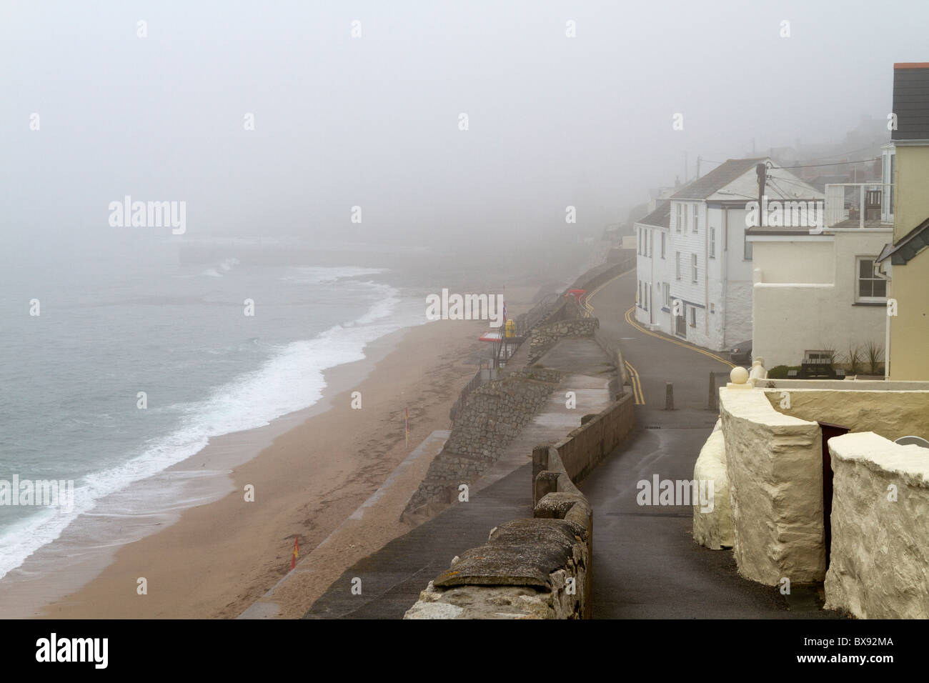 Fog at beach in Porthleven, Cornwall, UK Stock Photo - Alamy