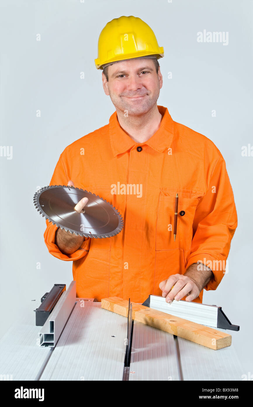 construction worker and circular saw Stock Photo - Alamy