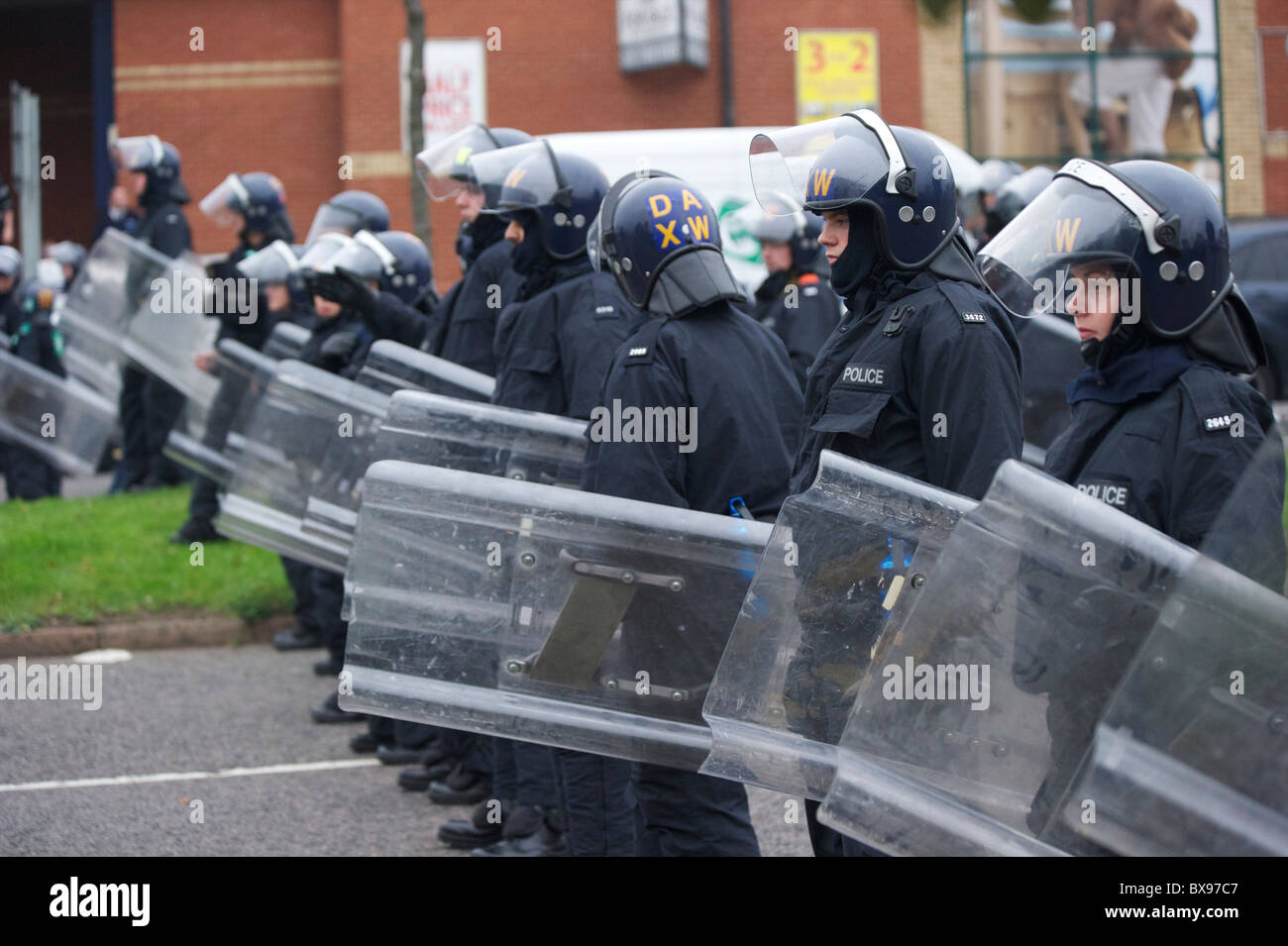 A phalanx of police officers, numbering in excess of 1,400, equipped ...