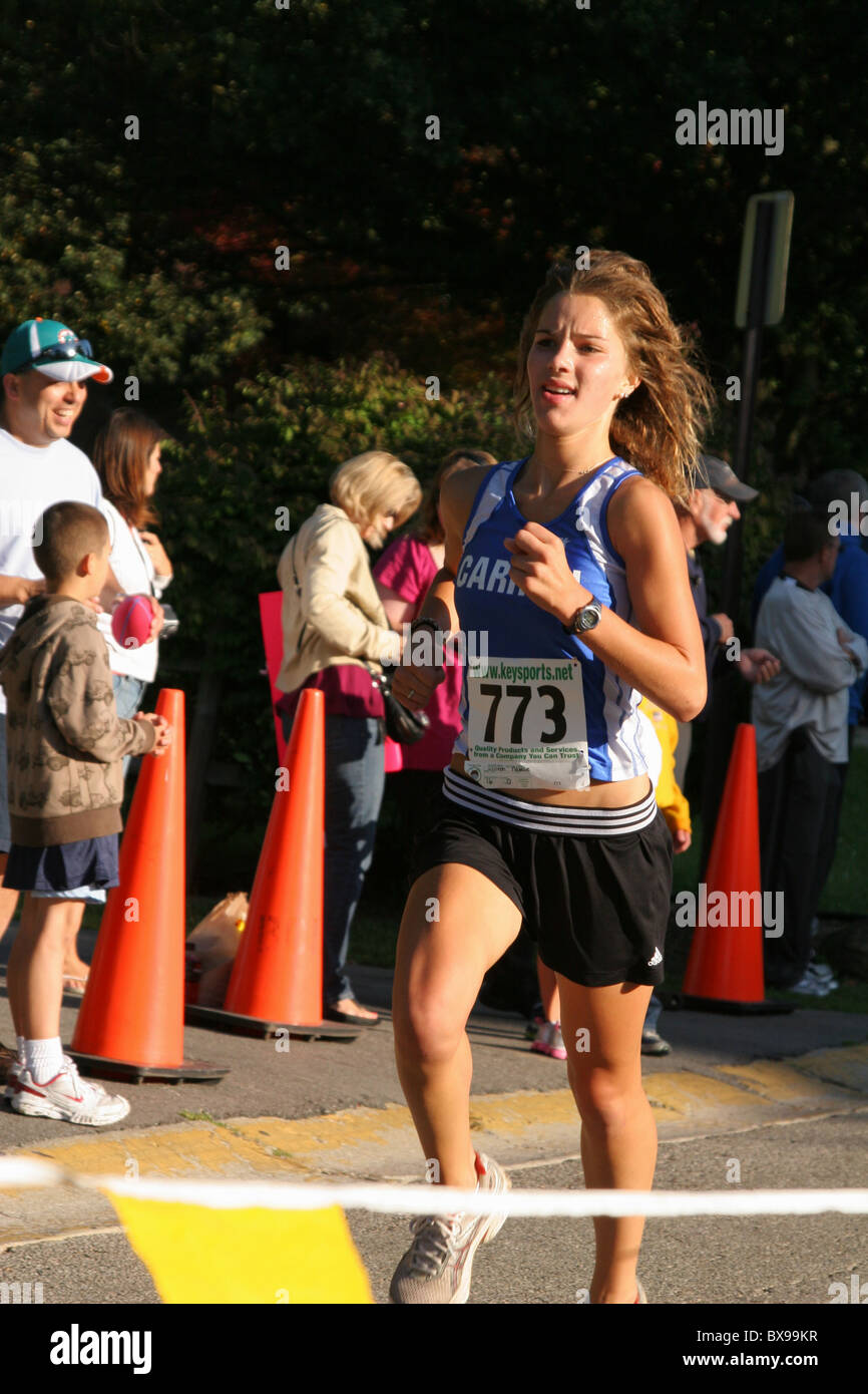 Age 16 female Natalie Winton finishes a footrace. Beavercreek Popcorn ...