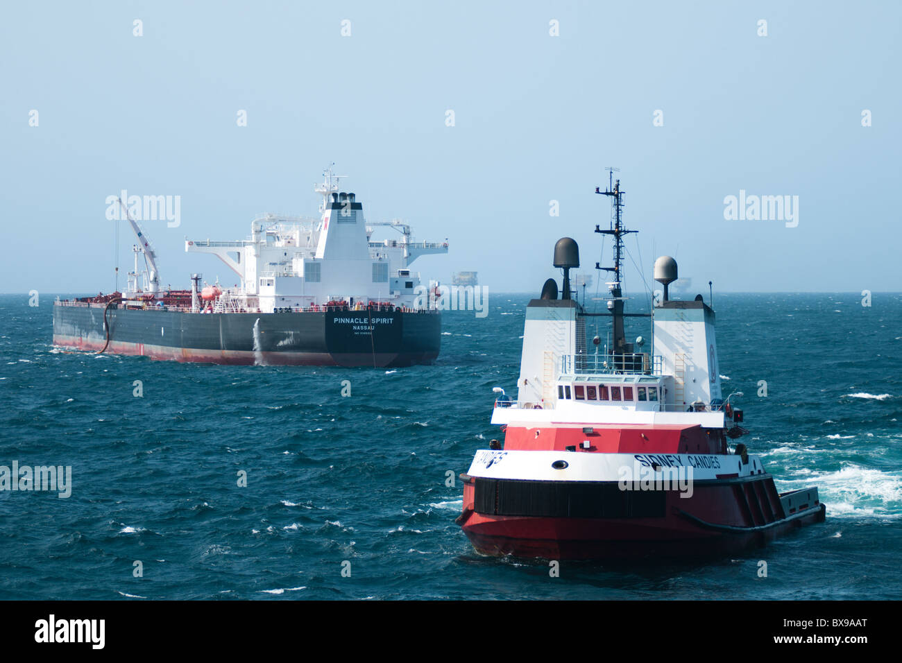 Tug boat towing an oil tanker vessel. Offshore Rio de Janeiro, Brazil ...