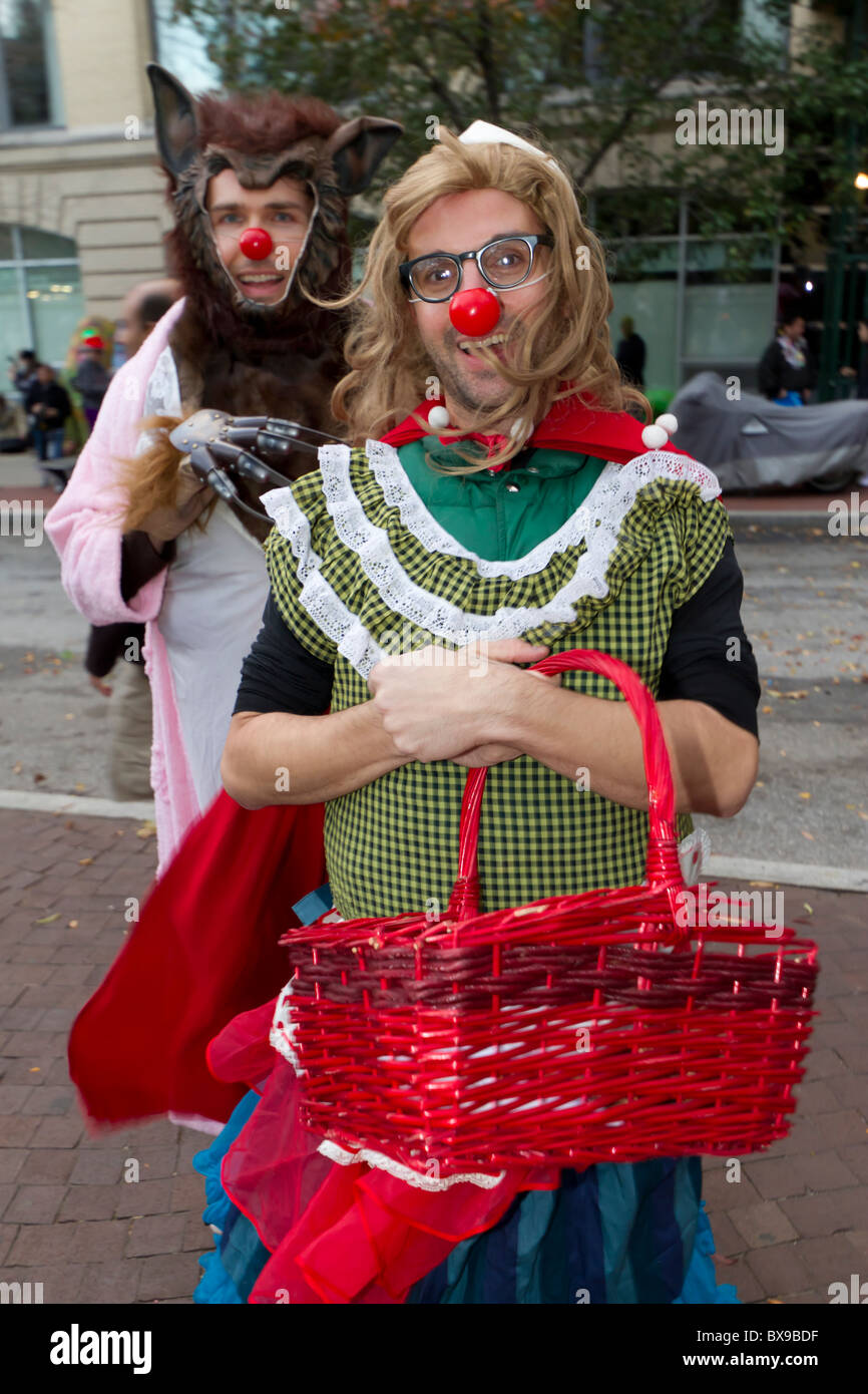 Two men dressed as Little Red Riding Hood and the Big Bad Wolf prepare ...