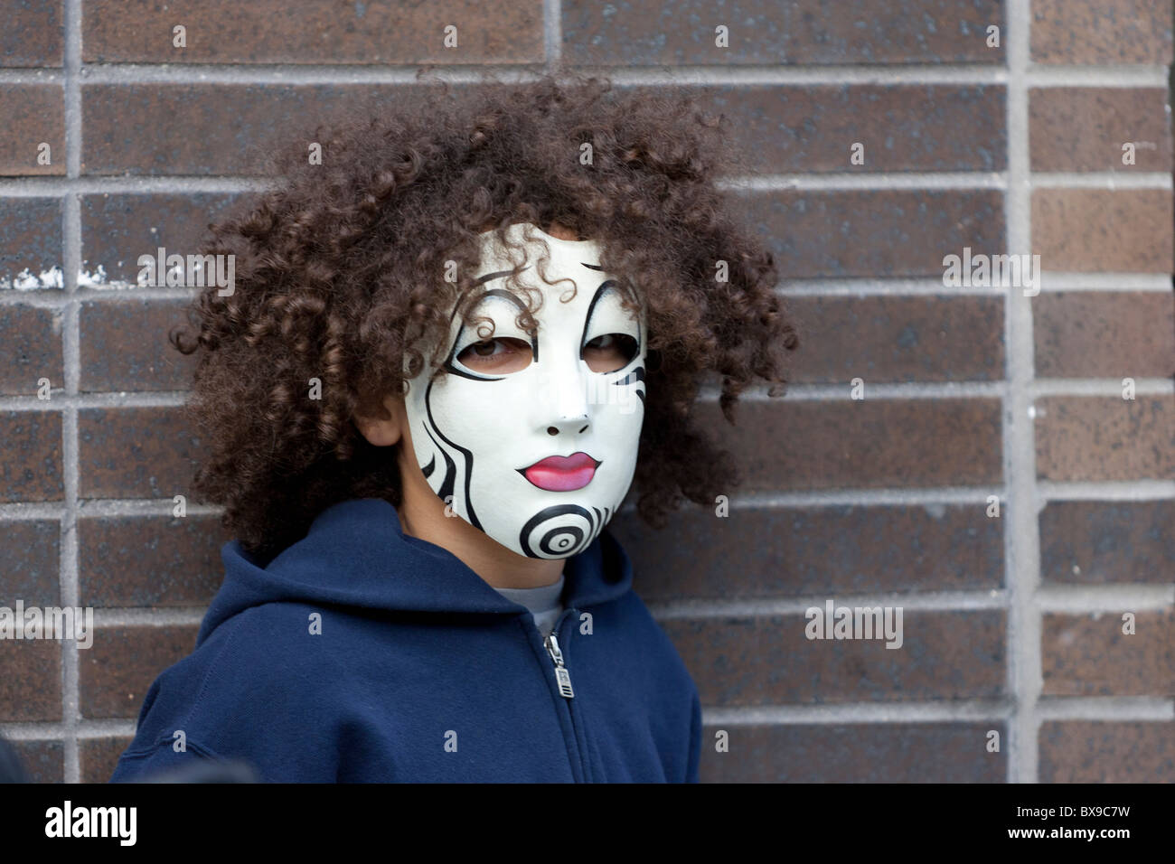 A curly haired young man in an eerie mask at the 2010 Greenwich Village ...